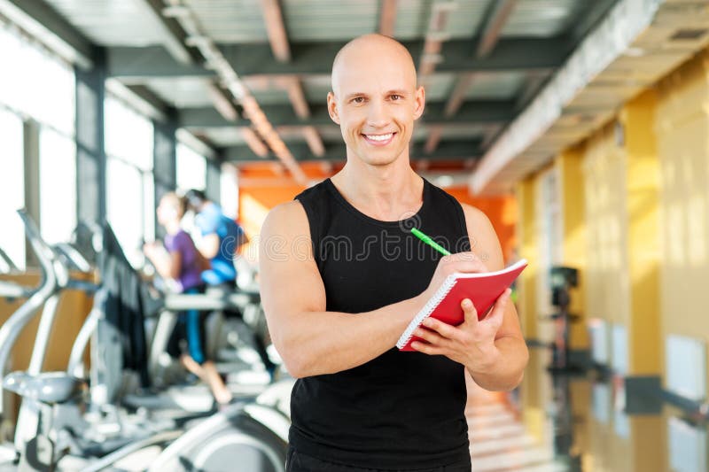 Fitness Instructor Writing Notes in Notebook Stock Image - Image of ...