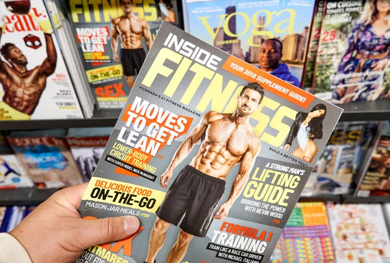 Fitness magazine in a hand editorial photo. Image of culture - 145252336