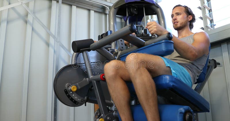 Fitness Man Doing Hamstring Curls in Leg Curl Machine Aka Hamstring ...