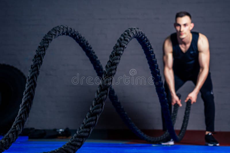 Fitness Man Training with Battle Rope in Fitness Club Stock Photo ...
