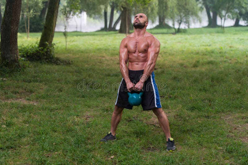 Fitness in Nature - Kettlebell Workout Stock Photo - Image of nature ...