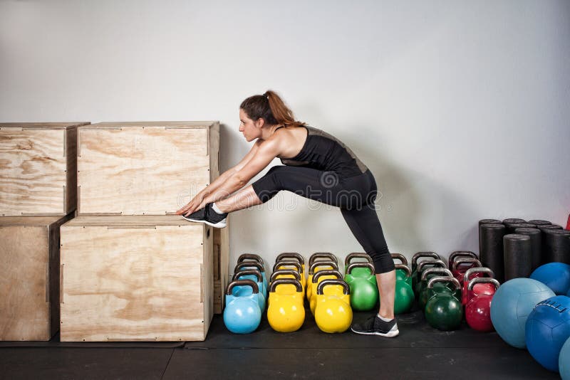 Woman Doing Kettlebell Exercise In A Gym Stock Image - Image of brown ...