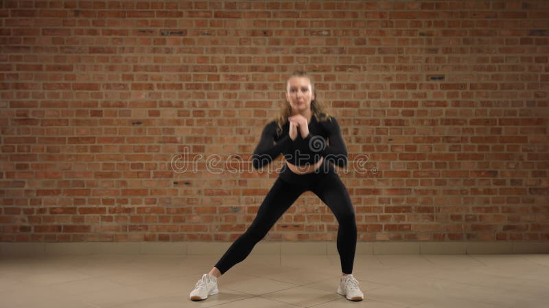 Fitness Trainer in Black Athletic Wear Expertly Demonstrates Side ...