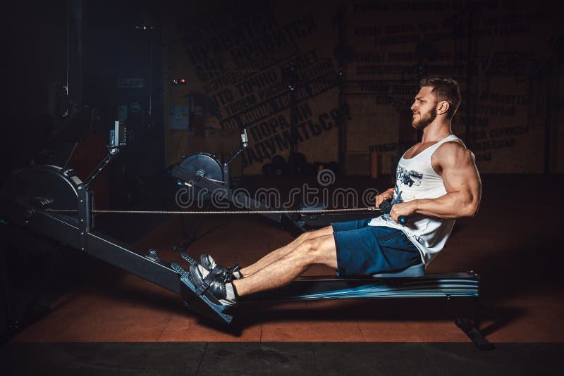 150 Man Using Rowing Machine Stock Photos - Free & Royalty-Free Stock ...