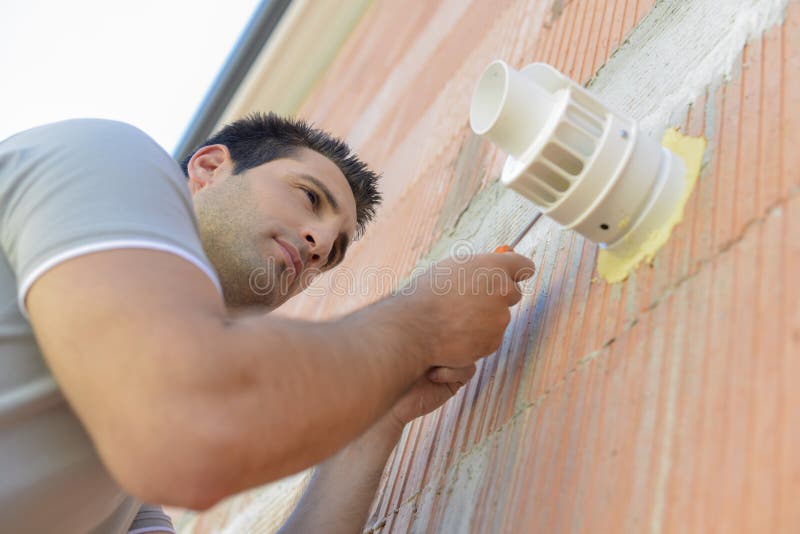 Fitting an extraction unit stock image. Image of technology - 133528087