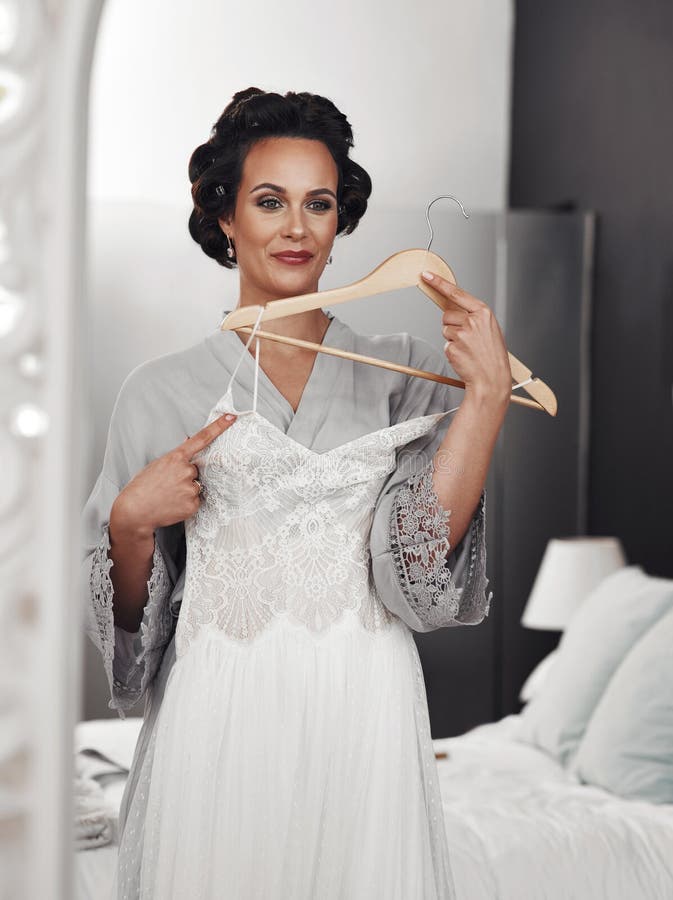 Fitting, Mirror and Bride with Elegant Gown in Bedroom Getting Ready ...