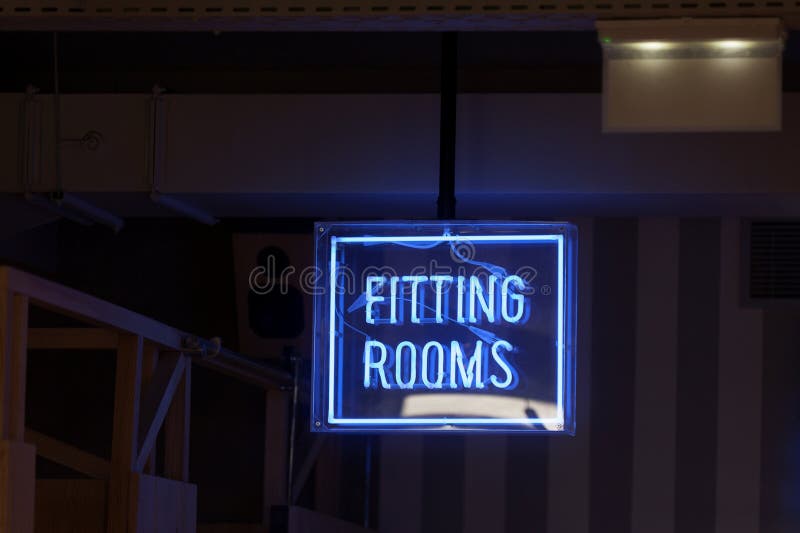 To the Fitting Rooms. Fitting Room Sign in the Mall Store Shop Retail ...