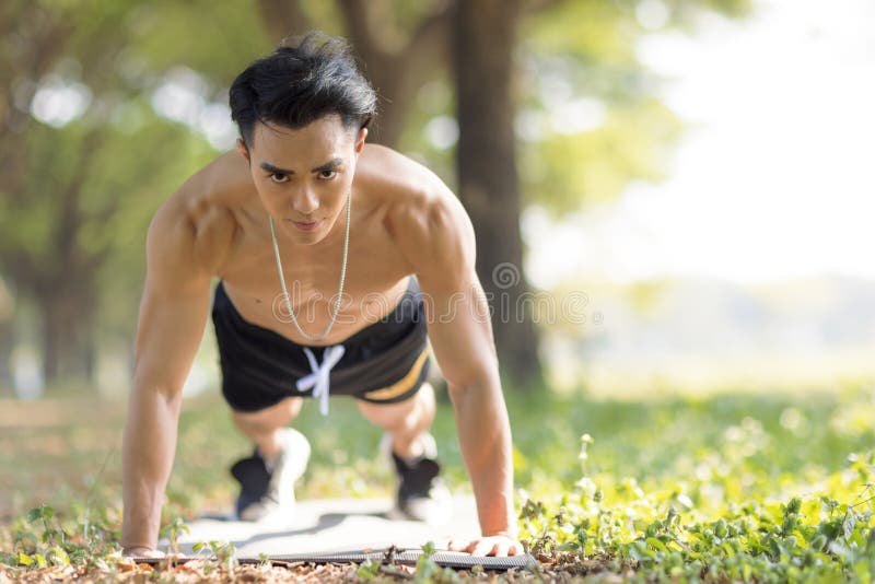 Fittness Asian Young Man Doing Exercises in the Park Stock Photo ...