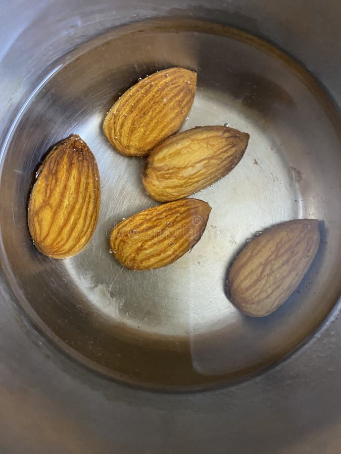 Five Almonds, Softened and Swollen from Soaking Stock Photo - Image of ...