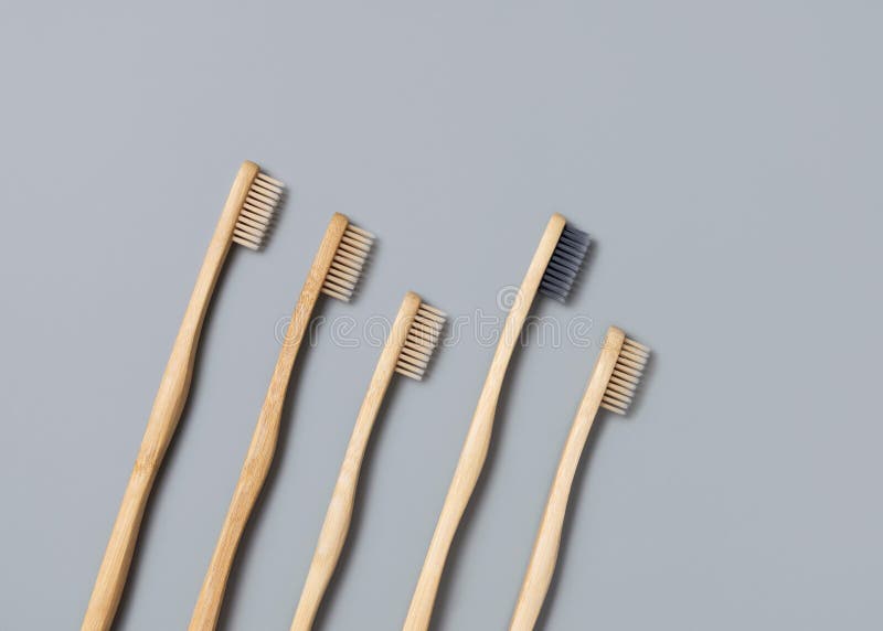 Five Biodegradable Bamboo Toothbrushes on a Light Gray Top View. Zero ...