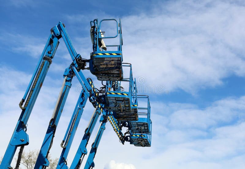 Five Blue Aerial Work Platforms of Cherry Pickers in a Row Stock Image ...