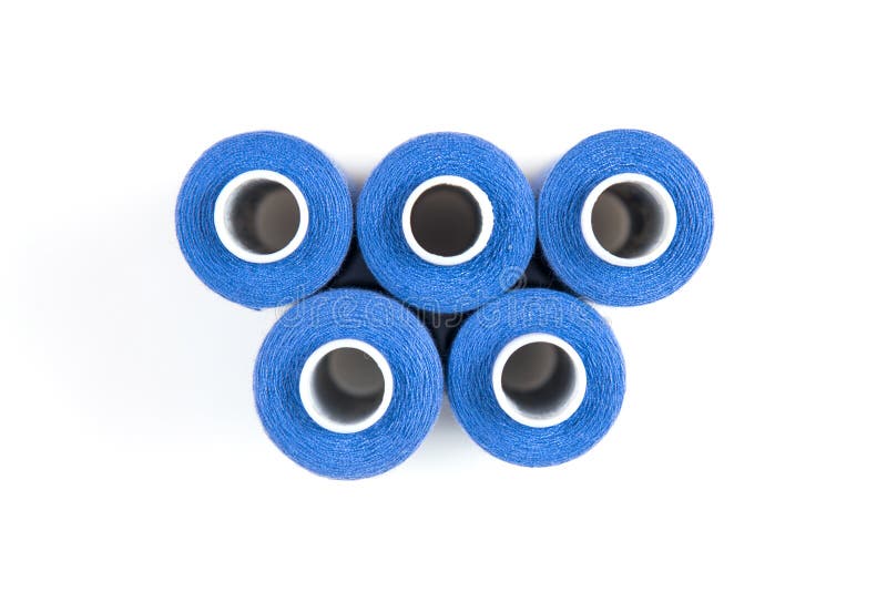 Five Blue Sewing Threads on a White Coils on a White Background. Sewing ...