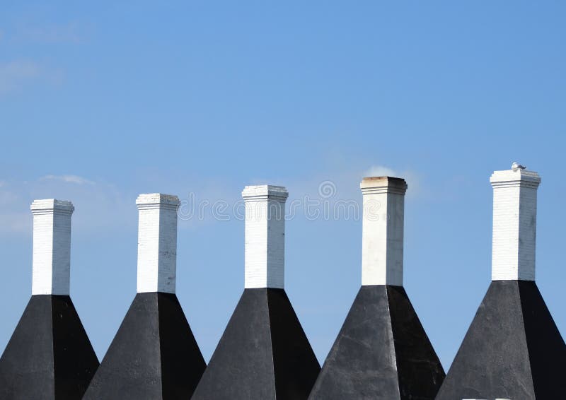 Five Chimneys on a Smokehouse with Blue Sky Stock Image - Image of ...
