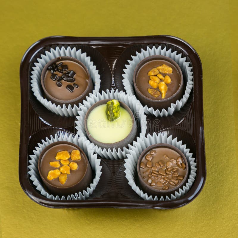 Five Chocolates on a Colored Background. Stock Image - Image of food ...