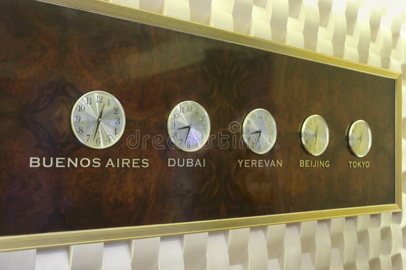 Five Clocks are on Wall and Show Different Stock Image - Image of ...