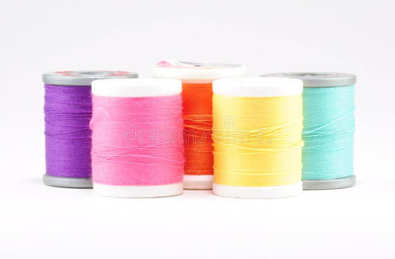 Five Colorful Spools of Thread Stock Image - Image of stitch, material ...