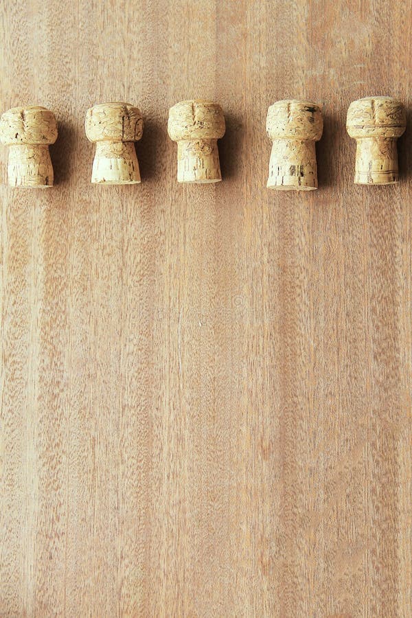 Five Corks from Champagne Cork Oak Lined in a Row on Top of the Wooden ...