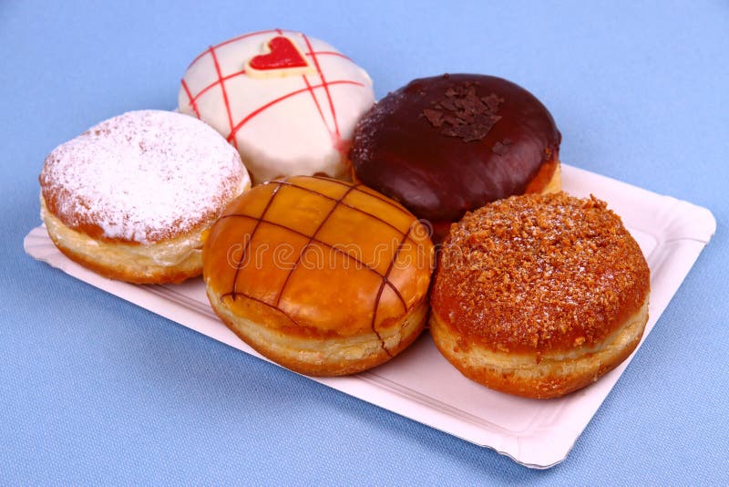 Five Delicious, Assorted Donuts on Plate Stock Photo - Image of colored ...