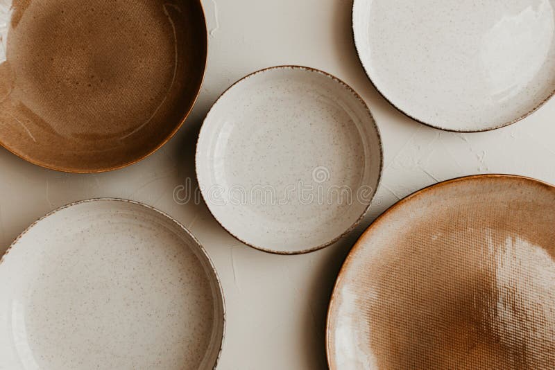 Five Different Size Plate on Beige Background Stock Image - Image of ...