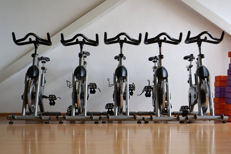 Five Exercise Bicycles in the Gym. Cardio Training Stock Image - Image ...