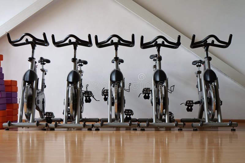 Five Exercise Bicycles in the Gym. Cardio Training Stock Photo - Image ...