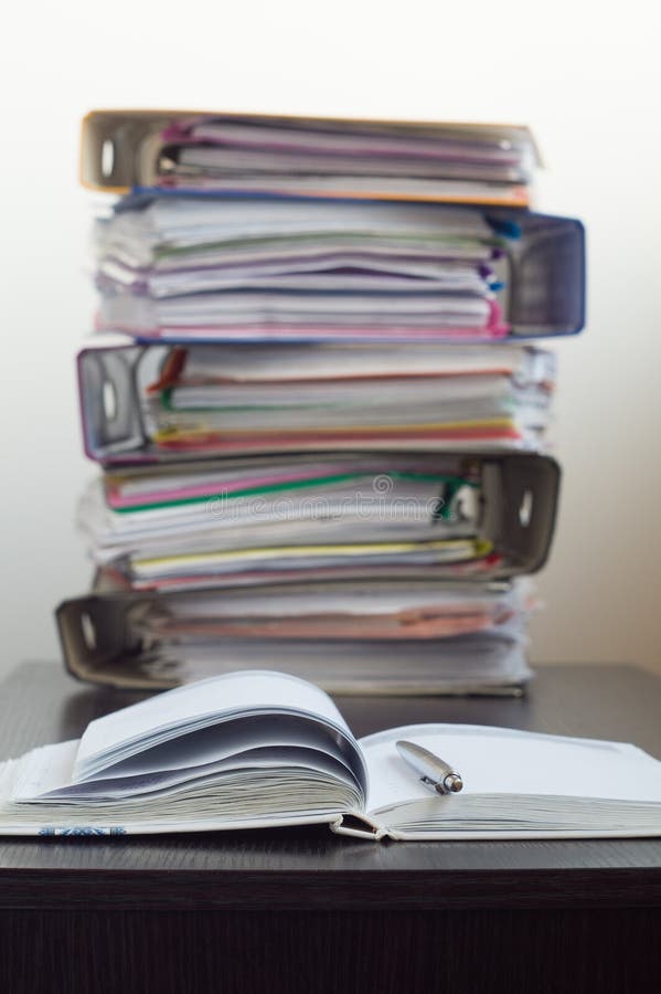 Five Folders with Documents Stacked in a Pile on the Table. Blac Stock ...