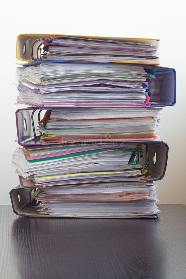 Five Folders with Documents Stacked in a Pile on the Table. Blac Stock ...