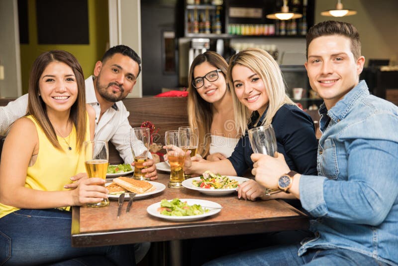 Five Friends Eating in a Restaurant Stock Photo - Image of hour, food ...
