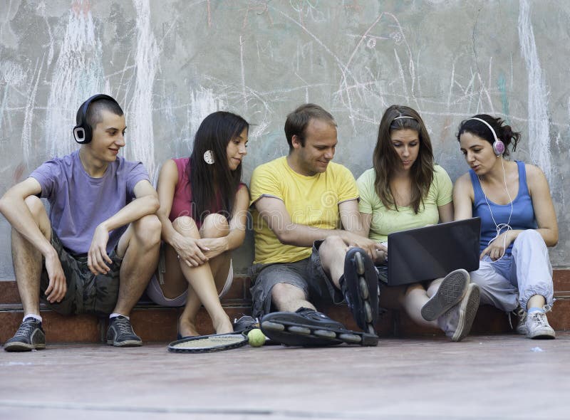 Five friends sharing a hug stock photo. Image of outside - 25776362