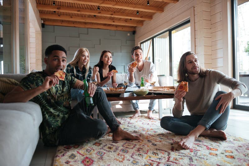 Five Friends Sitting in House and Eating Pizza Stock Photo - Image of ...