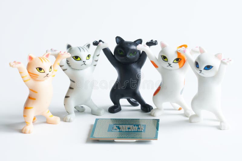 Five Funny Toy Kittens with Raised Paws Next To a Modern Powerful ...