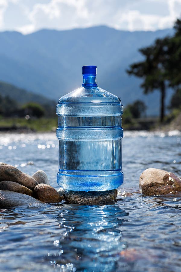 Water Big Bottle on Mountains and Rivers Background Stock Image - Image ...