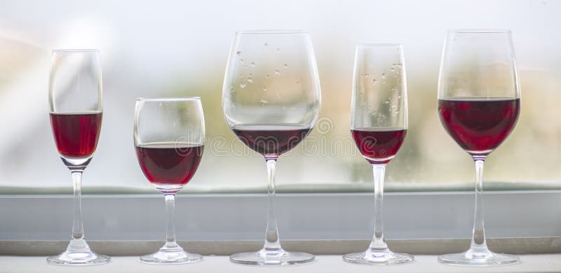 Five glasses of red wine stock image. Image of home - 206246675