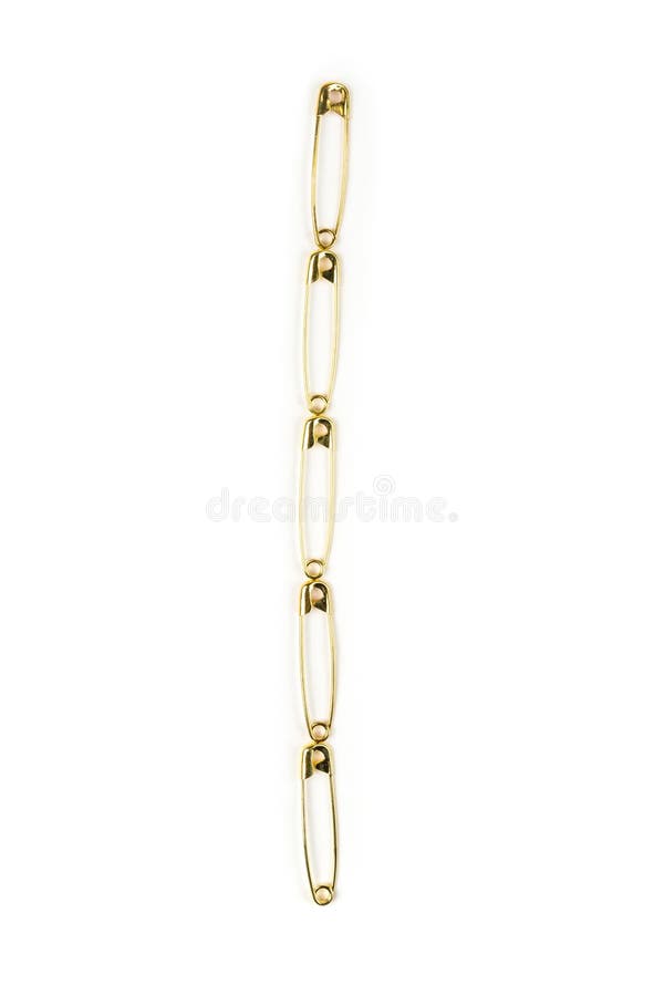 Five Gold Safety Pins Together in a Line on a White Background Stock ...