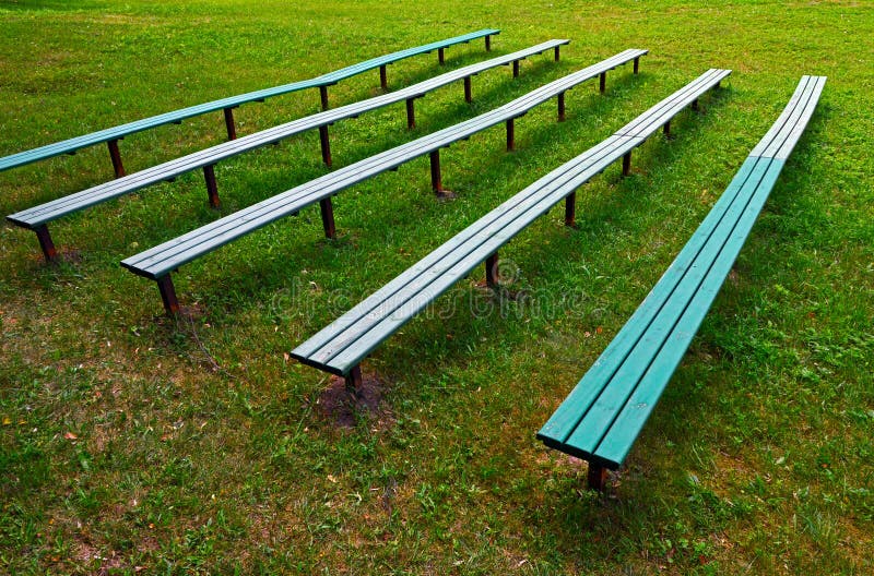 Five green benches stock image. Image of board, concert - 152797227