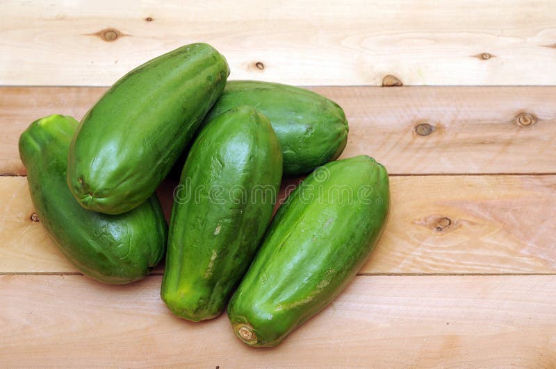 Five Green Papaya on Wooden Table Stock Image - Image of delicious ...