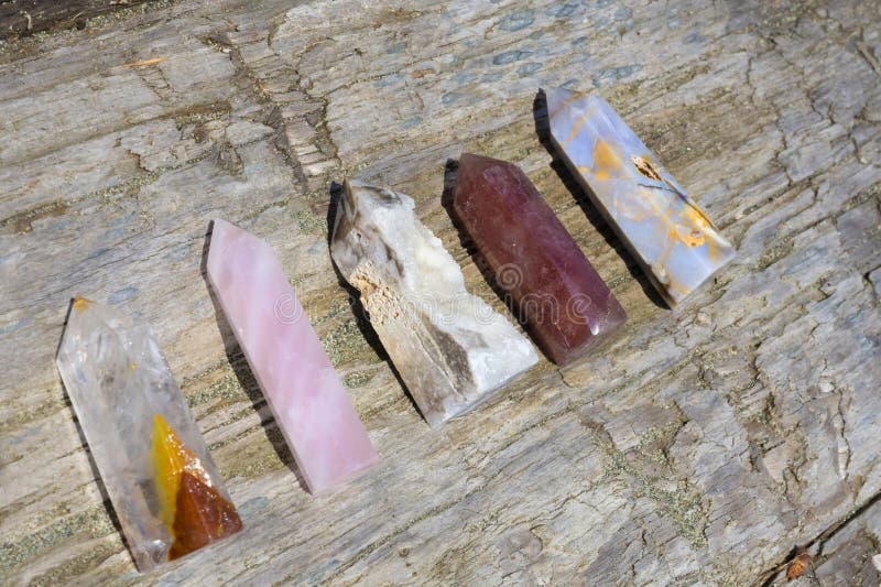 Five Healing Crystal Towers on Driftwood Stock Photo - Image of ...