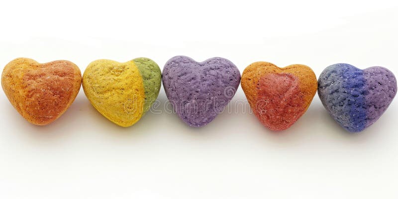 Five Heart-shaped Stones, Each a Different Color, are Lined Up on a ...