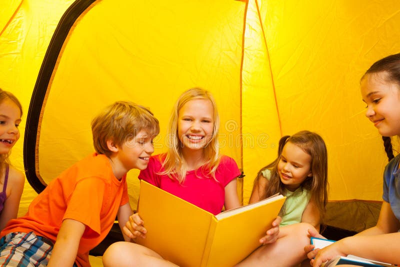 Five Kids Read Books in a Tent Stock Image - Image of orange, hold ...