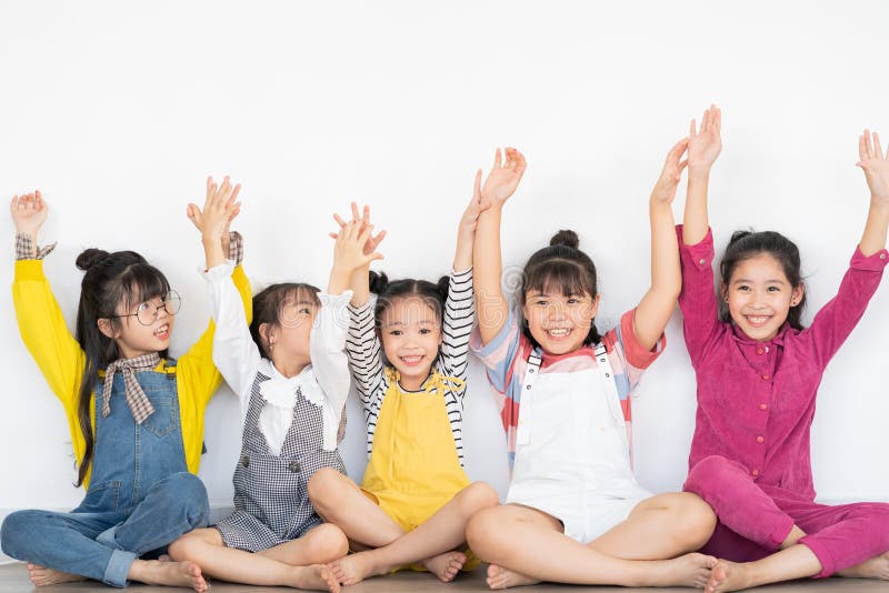 Five Little Girls Raising Their Hands Stock Image - Image of background ...