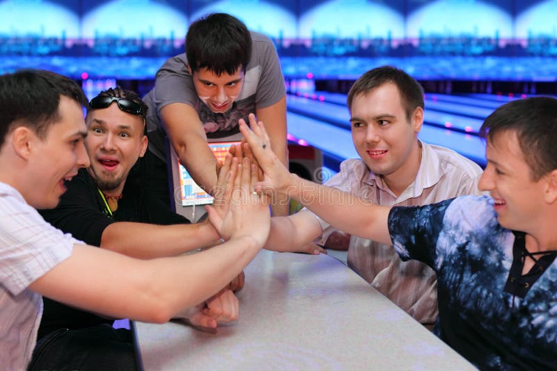 Five Men Sit at Table and Touch Hands in Bowling Stock Image - Image of ...