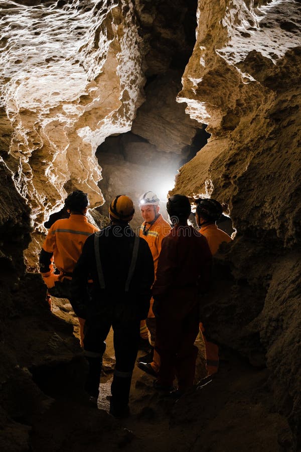 Five Men, Strong Physique, Explore the Cave. Men Dressed in Special ...