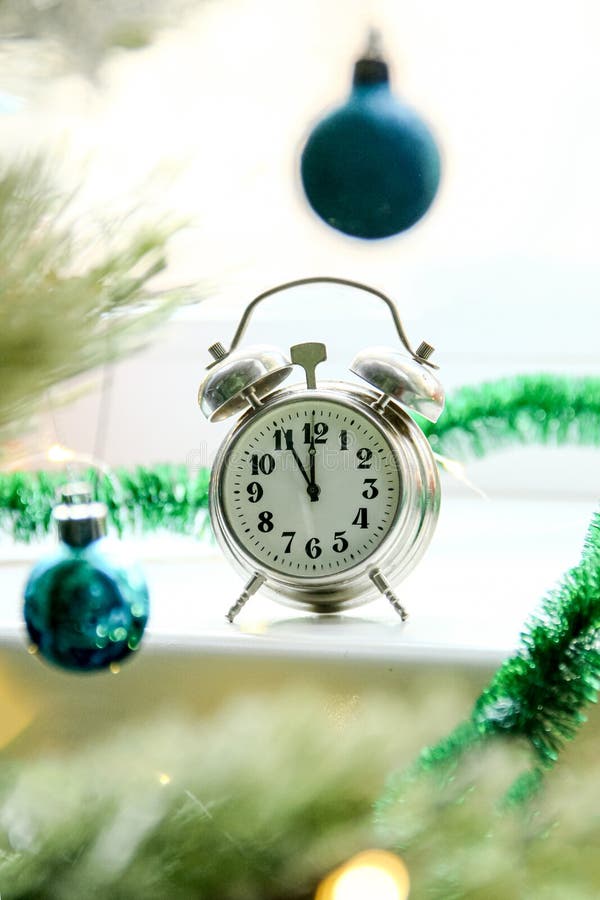 Five Minutes To Noon: a Clock on a Window Cell through Christmas Tree ...