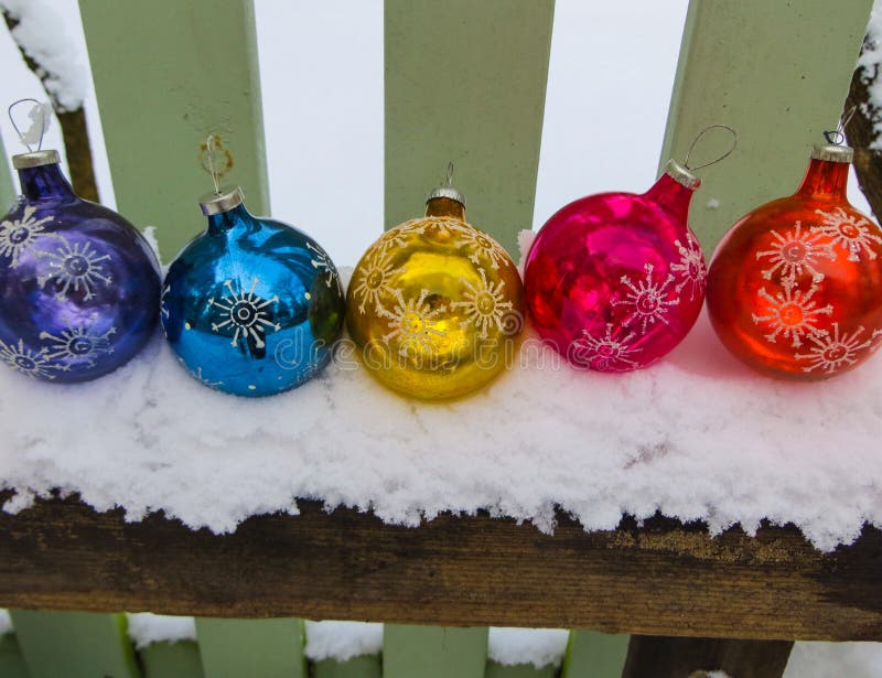 Five Multi-colored Christmas Balls in the Snow Stock Image - Image of ...