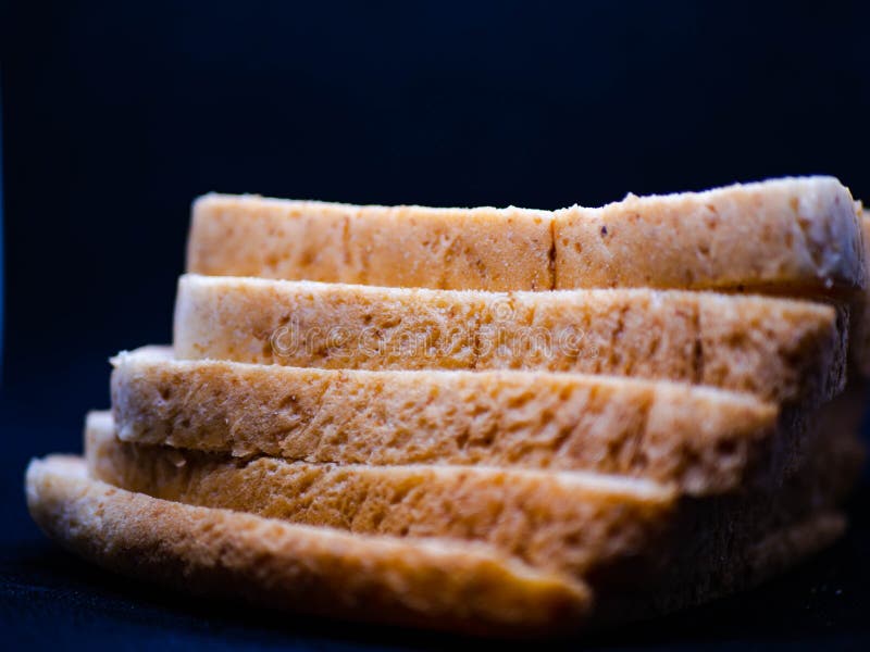 Bread and black background stock image. Image of food - 148503279