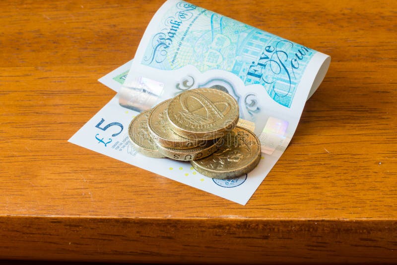 Five Pound in One Pound Coins and New 5 Pound Note Editorial Stock ...