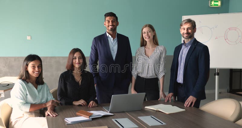 Five Professional Team Members Posing for Camera in Office Boardroom ...