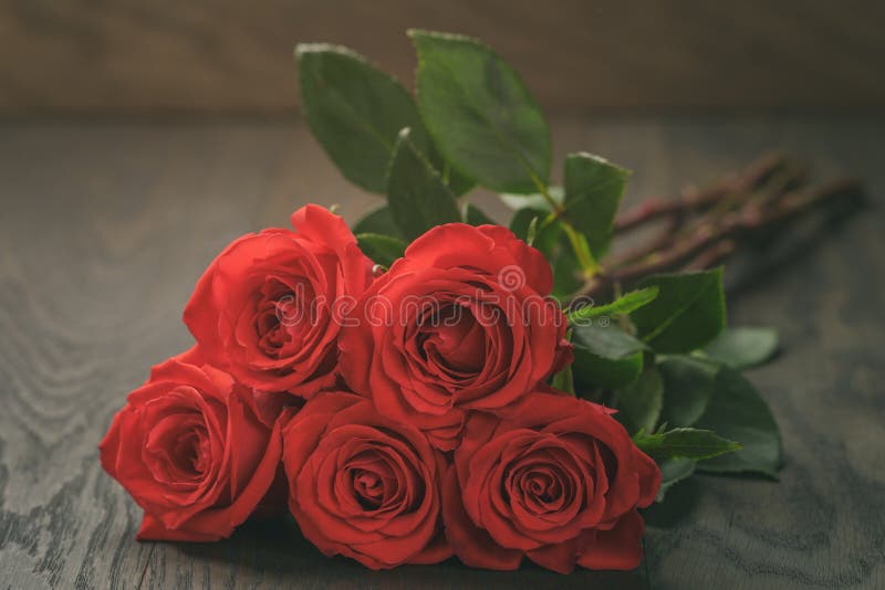 Five Red Roses on Wooden Table Stock Photo - Image of nature, card ...
