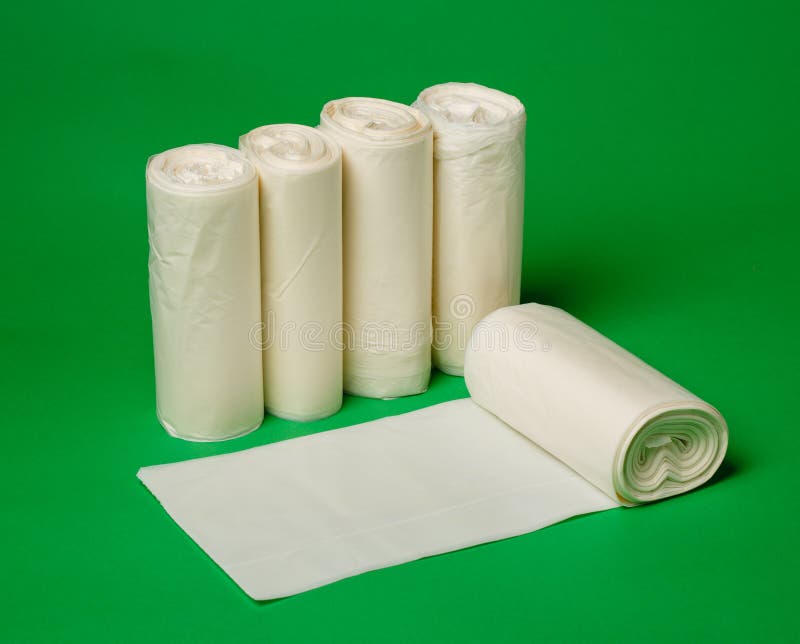 Five Rolls of Biodegradable Eco Plastic White Garbage Bags on Green ...