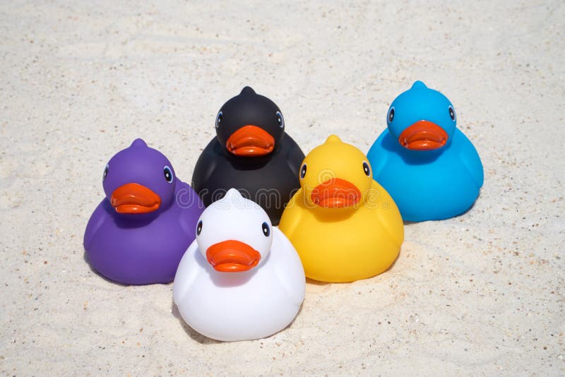 Five Rubber Ducks on the Beach Stock Photo - Image of outdoors ...